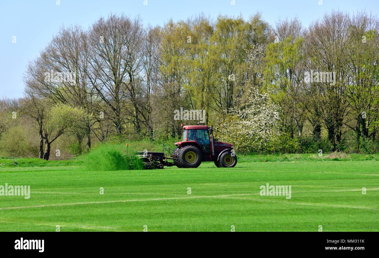 Case IH Cx100 tractor cutting the grass on a sports playing field Stock ...
