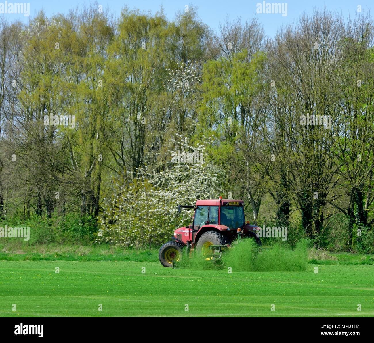 Case IH Cx100 tractor cutting the grass on a sports playing field Stock ...