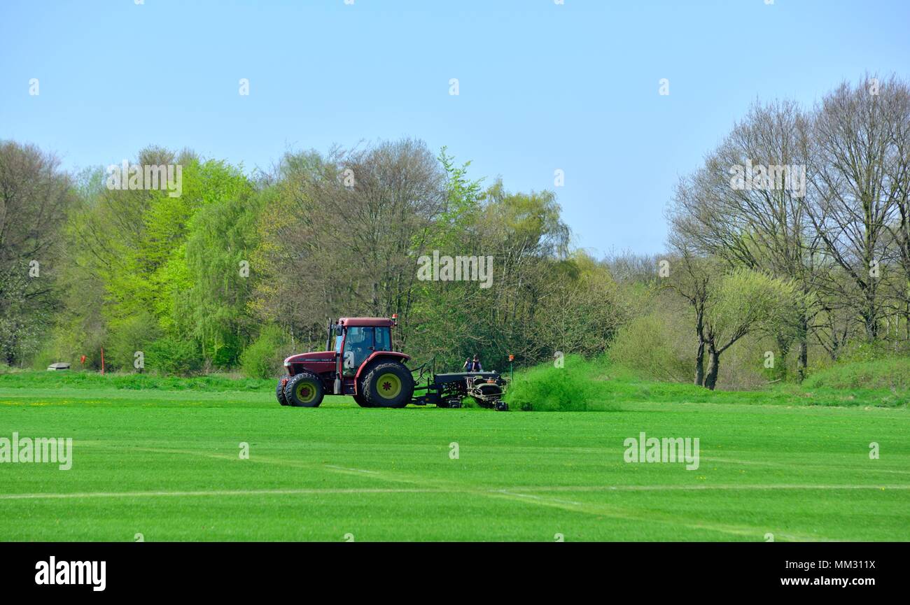 Case IH Cx100 tractor cutting the grass on a sports playing field Stock ...