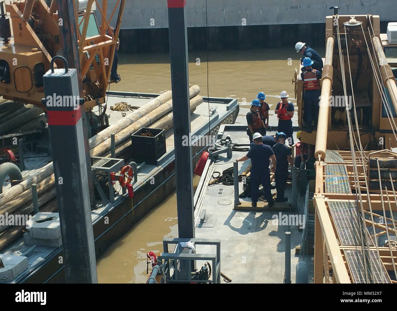 Crew members aboard Coast Guard Cutters Hatchet and Clamp, 75-foot ...