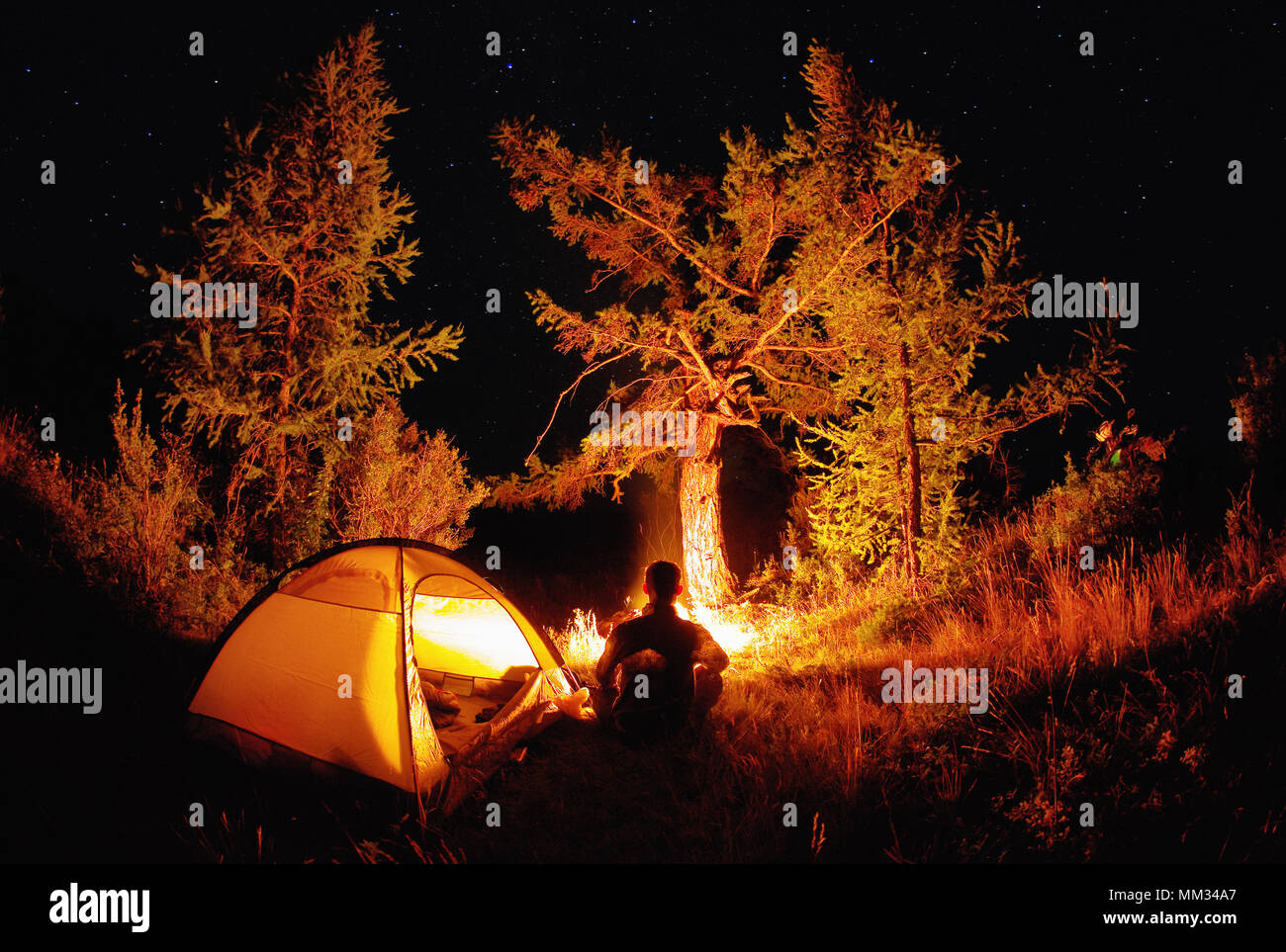 Sitting by fire hi-res stock photography and images - Alamy