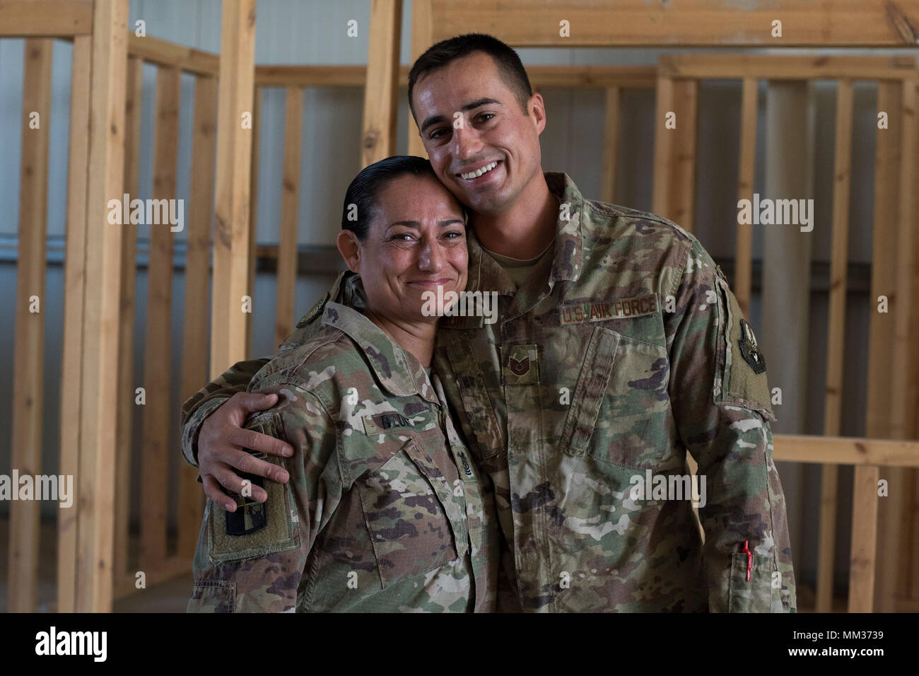 Tech. Sgt. Jason Blunt, 557th RED HORSE craft lead, right, hugs his mom ...
