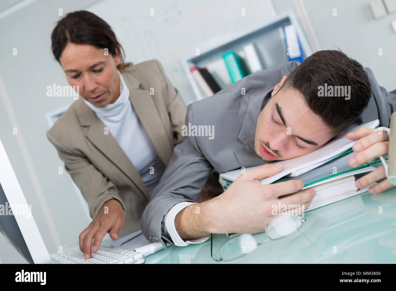 tired young man sleeping in the office Stock Photo - Alamy