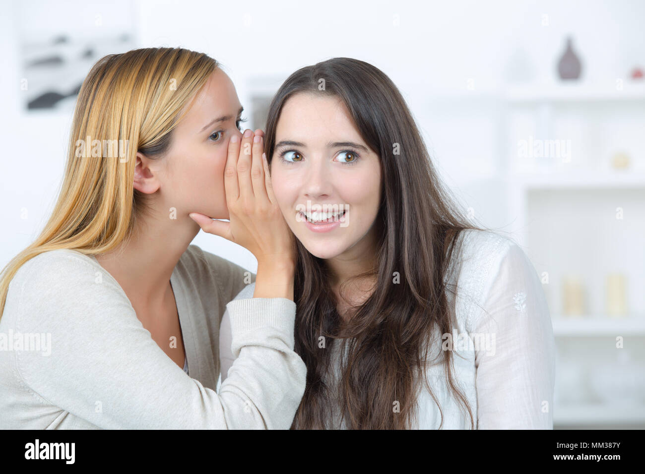 Telling secrets hi-res stock photography and images - Alamy
