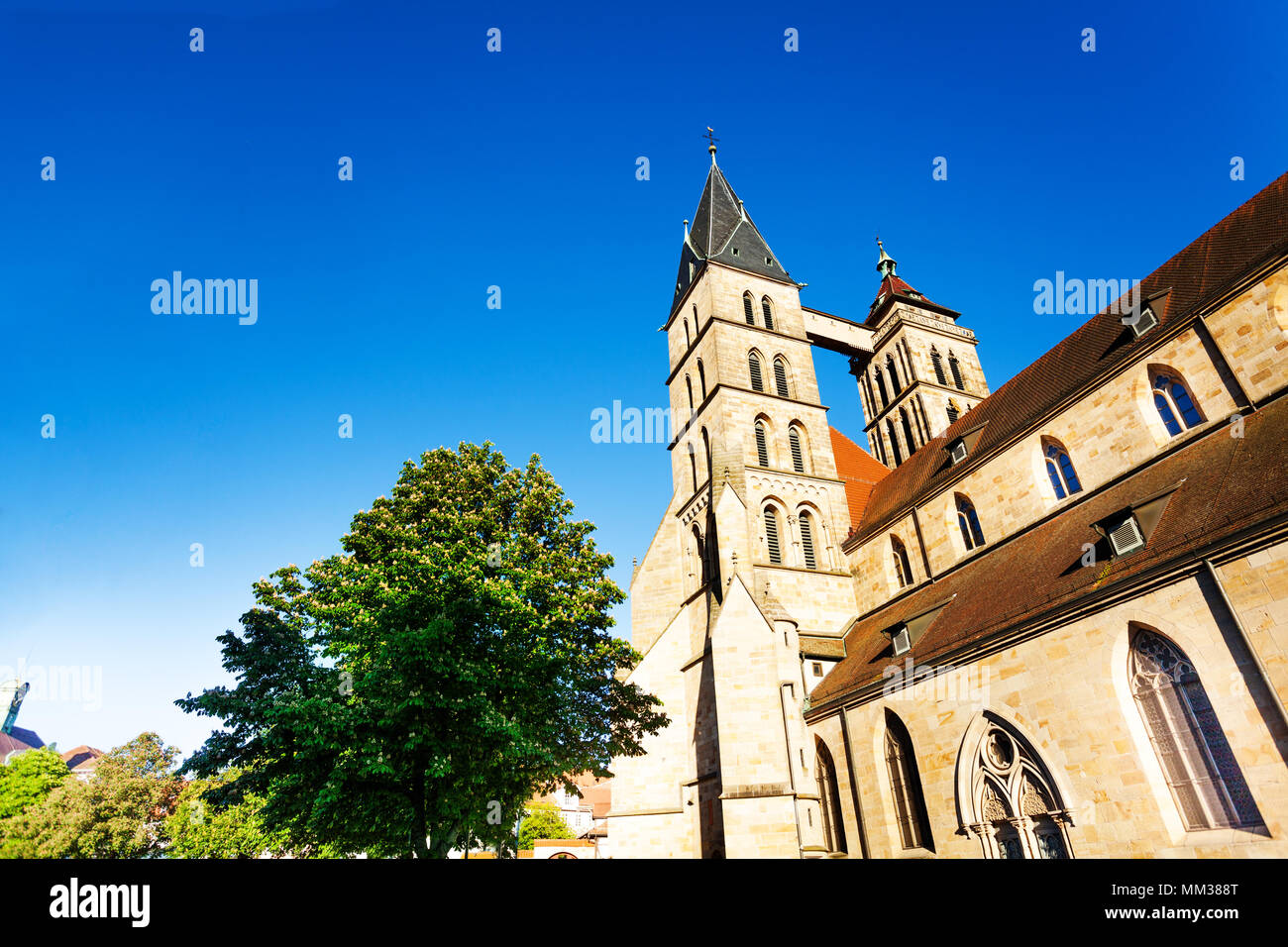 Low-angle view of Saint Dionysius church with its twin bell tower in ...