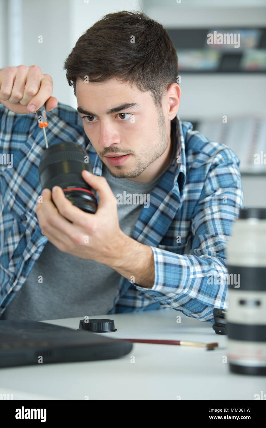 disassembling the camera lens Stock Photo - Alamy