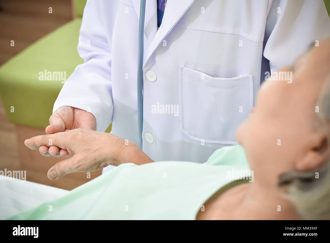 Doctor aiding patient hi-res stock photography and images - Alamy