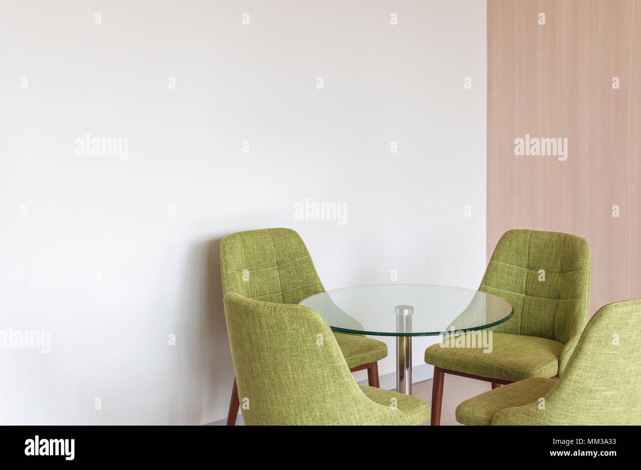Close up green chair modern style on white concrete corner background ...