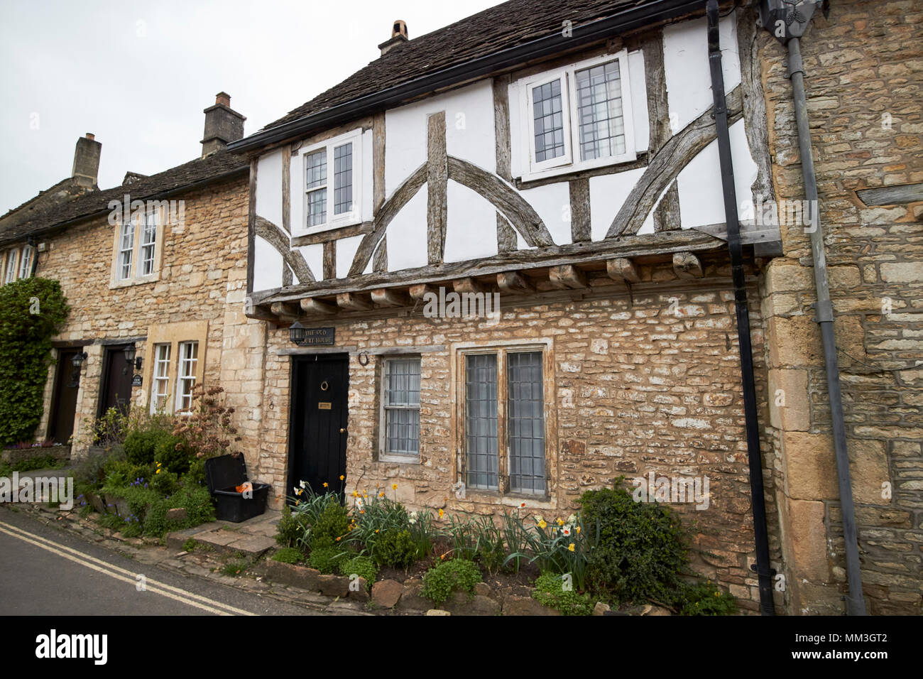 The old court house building with timber framed upper storey and stone ...