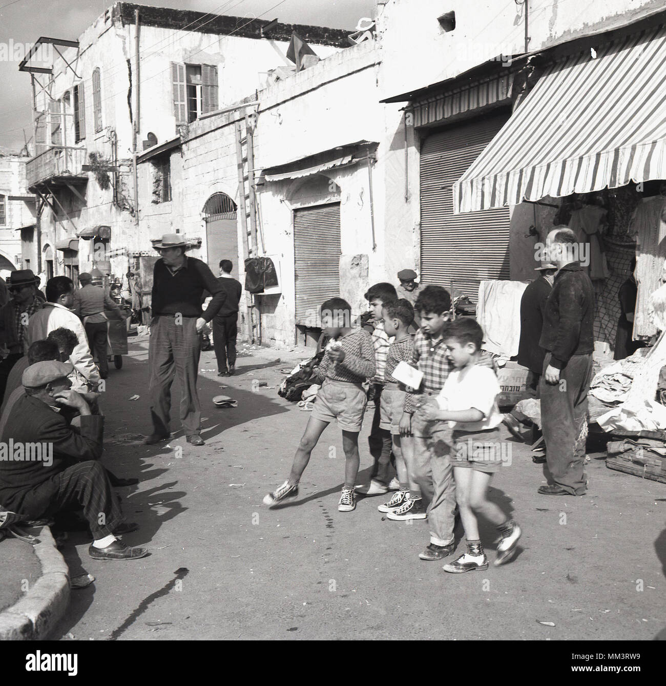 1950s, historical, group of small children in a back street of ...
