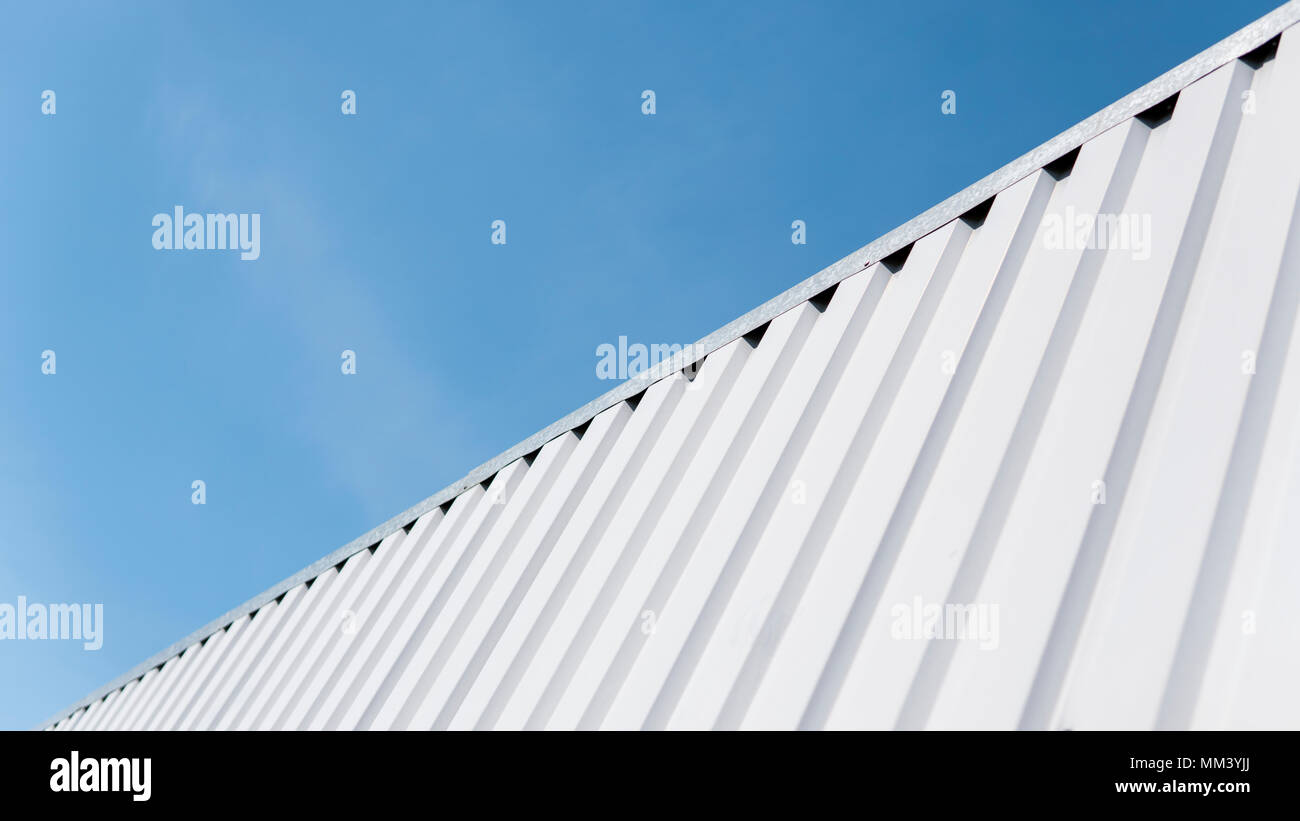 Metal white sheet for industrial building and construction on blue sky ...