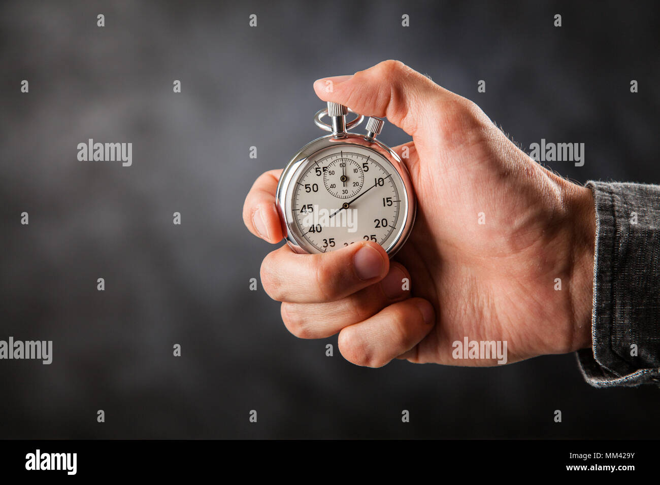 Analog stopwatch on black background Stock Photo - Alamy