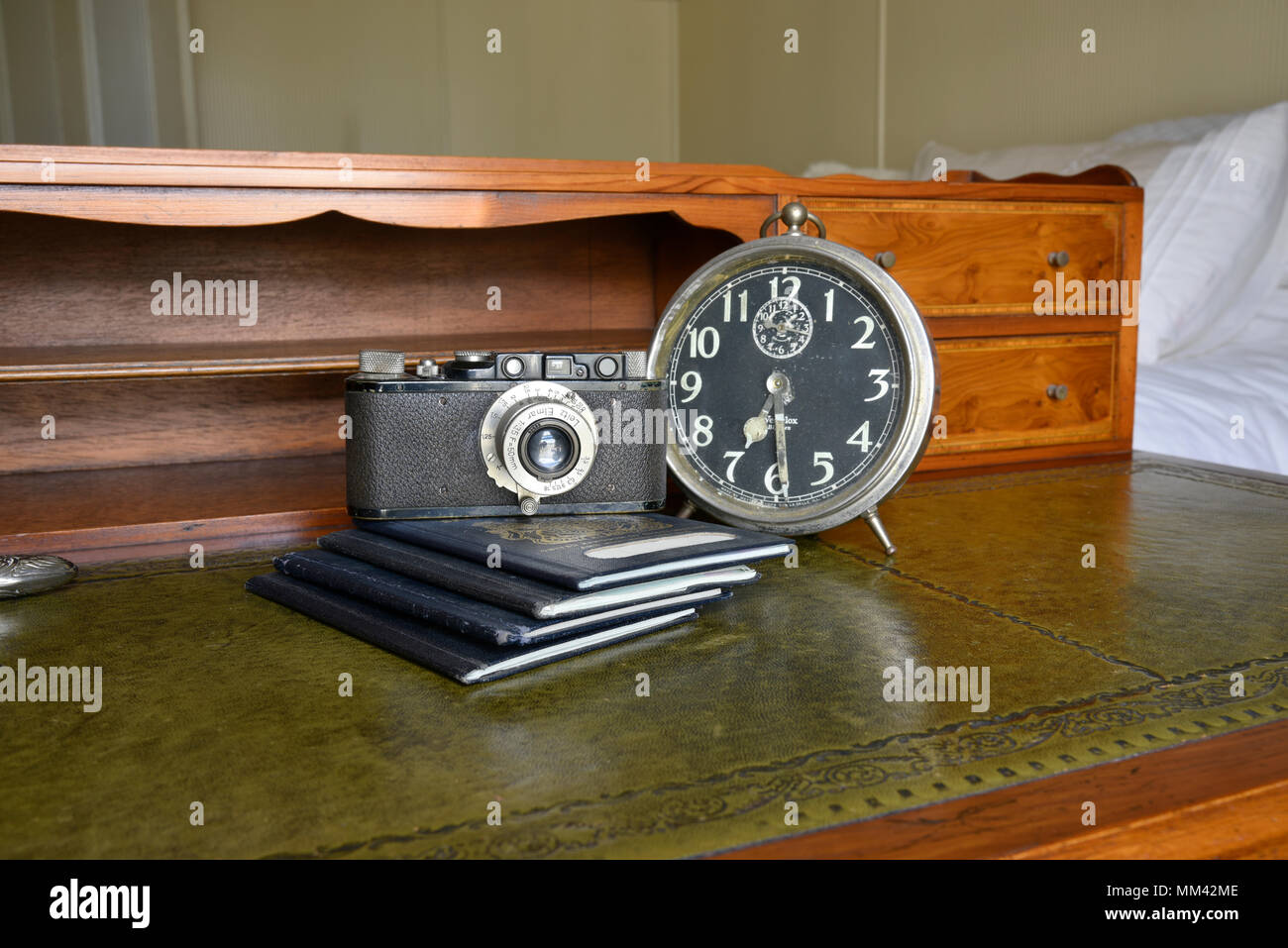 antique timber desk with passports and vintage leica II from 1932 ...