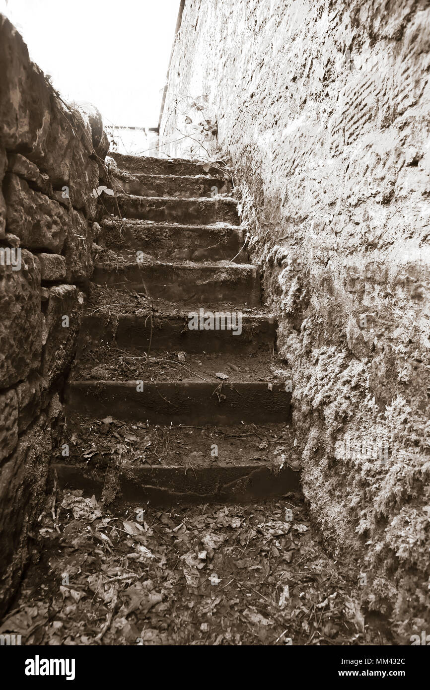 Rough hewn ancient stone steps, worn with time Stock Photo - Alamy