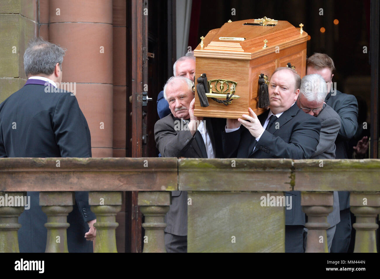The coffin of Michael Martin is carried from St Aloysius in Glasgow ...