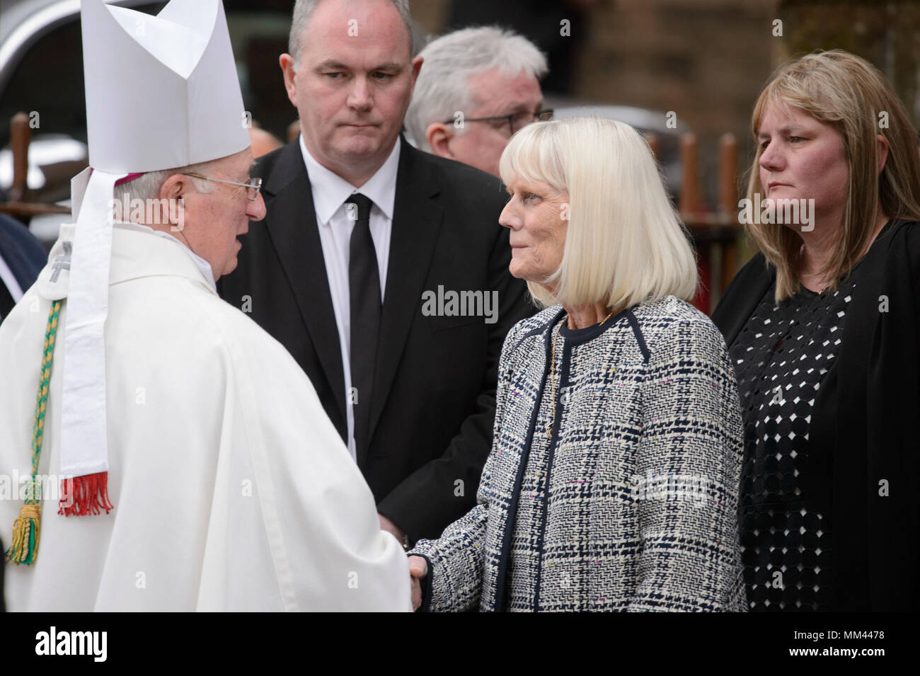 Archbishop Emeritus Mario Conti (left) speaks with Mary Martin and Paul ...