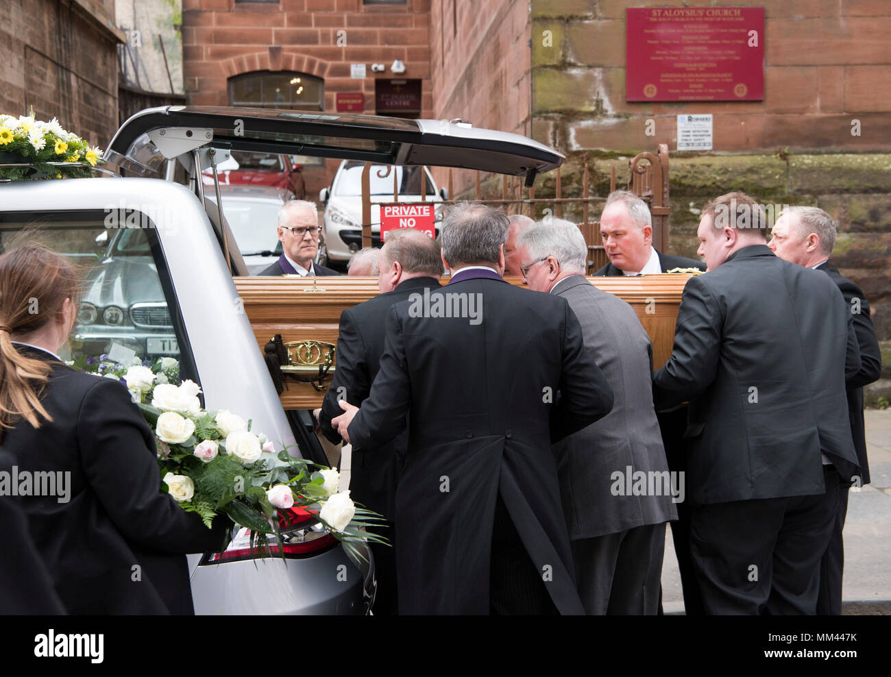 Paul Martin (third from right) carries the coffin of his father Michael ...