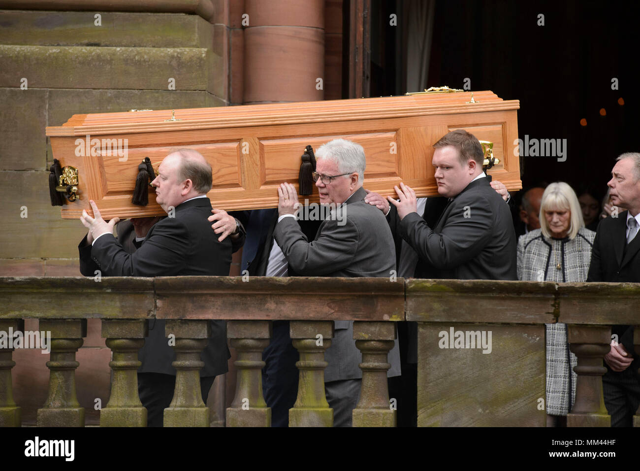 The coffin of Michael Martin, followed by his widow Mary Martin, is ...