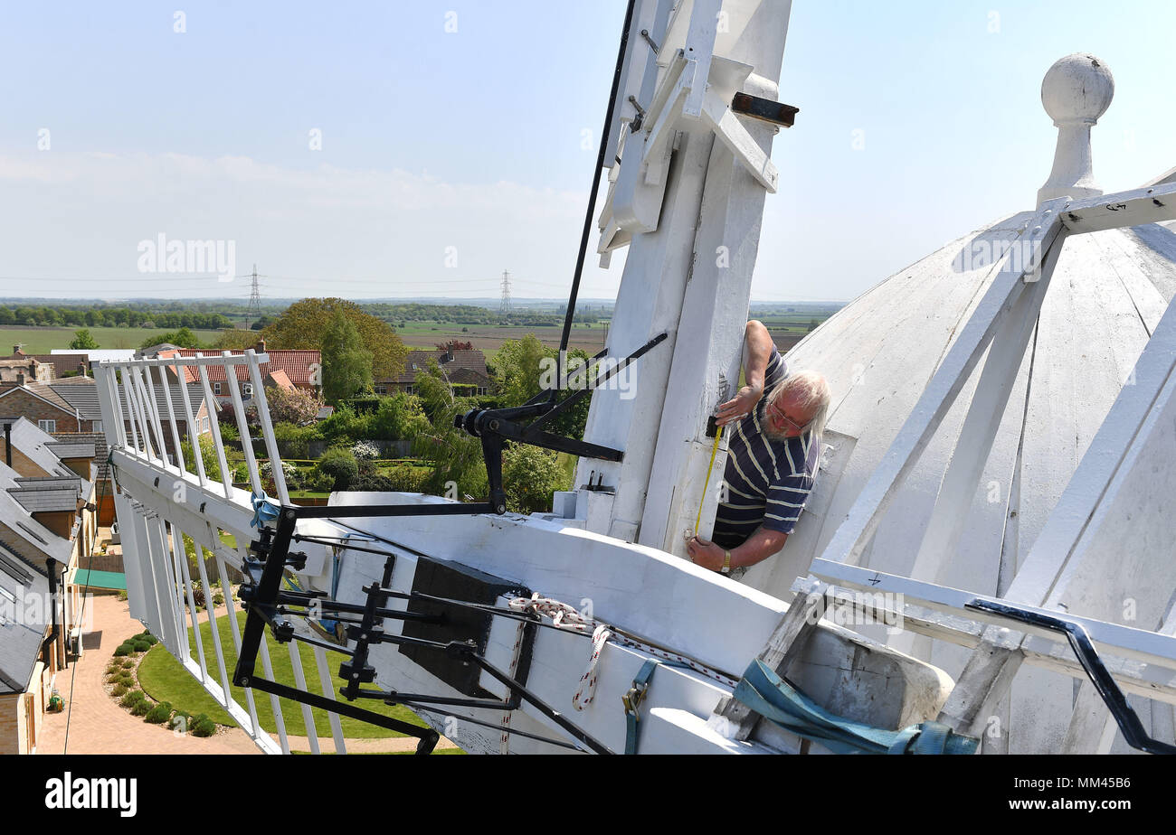 Miller Dave Pearce measures a supporting beam from the storm hatch of ...