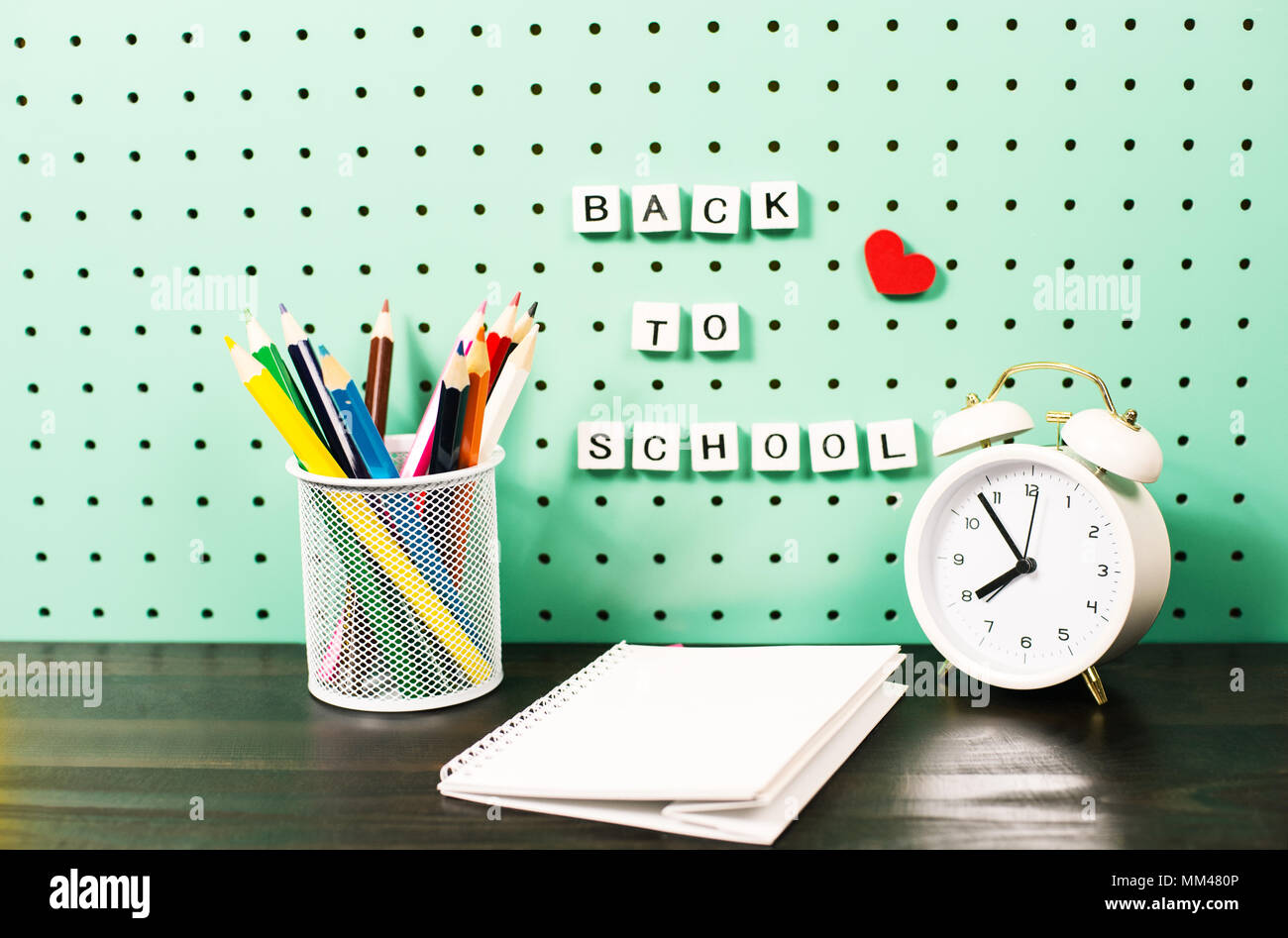 Back to school supplies pastel workspace with trendy items and wooden ...