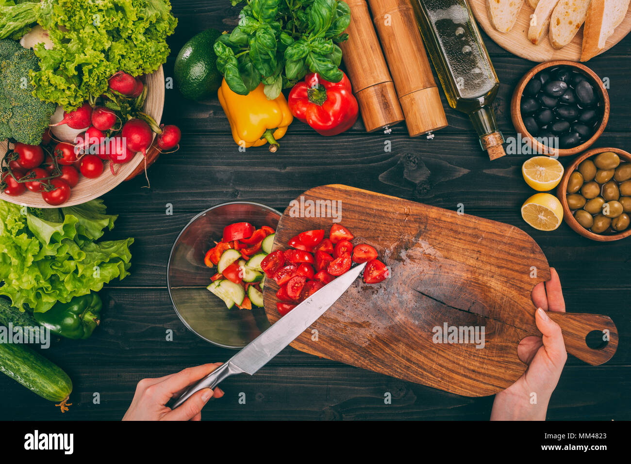 hands holding choping board with knife Stock Photo - Alamy