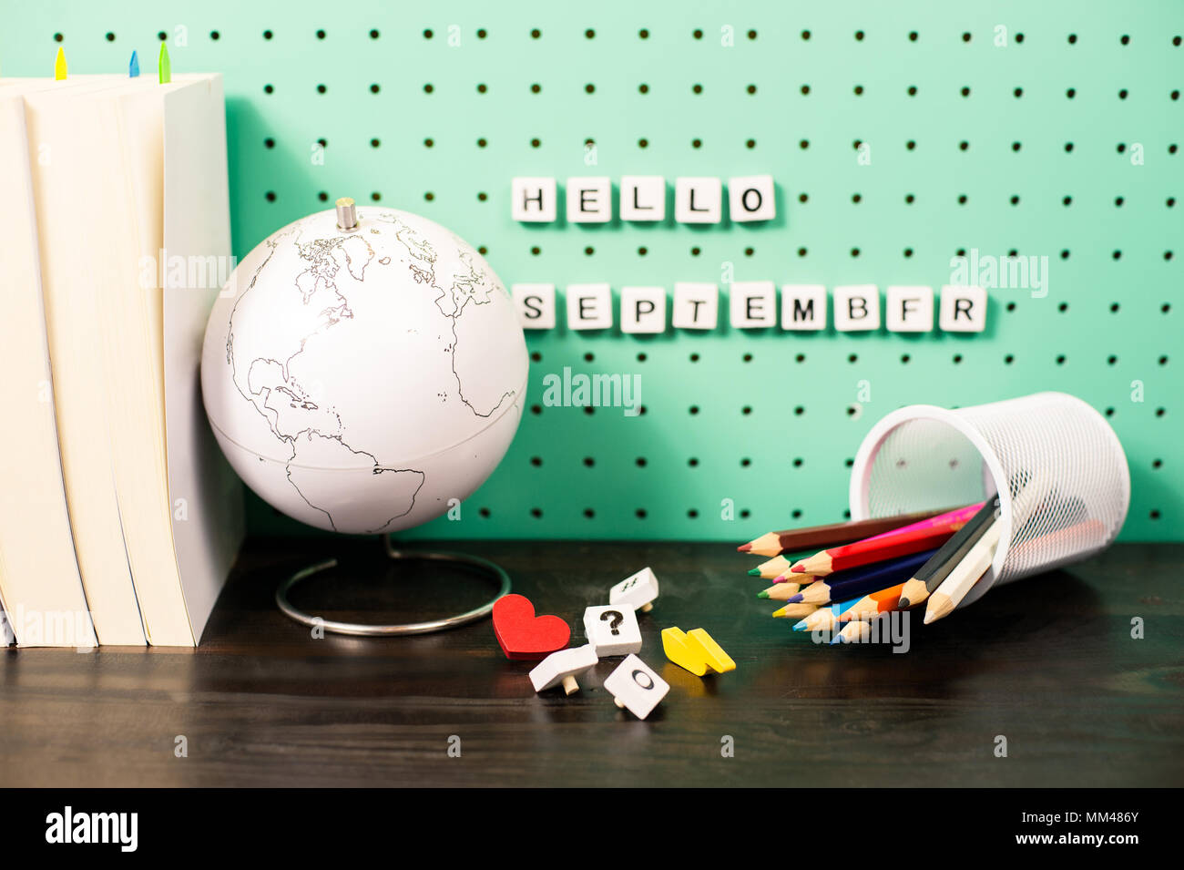 Back to school supplies pastel workspace with trendy items, globe and ...