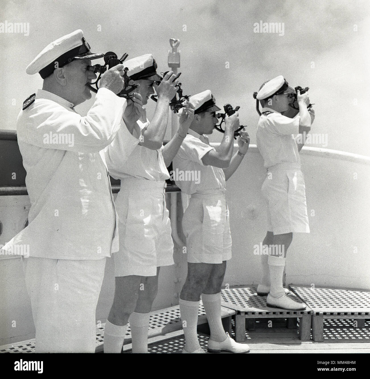 1950s, historical, four deck officers onboard a steamship using ...