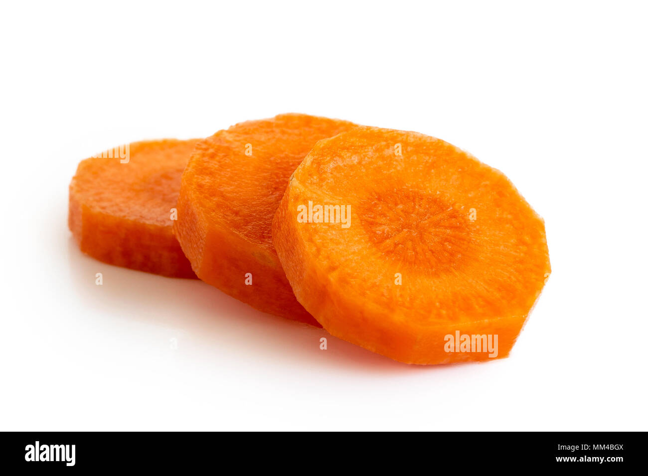 Three round slices of peeled carrot isolated on white Stock Photo - Alamy