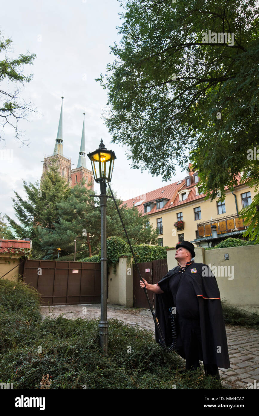Lamplighter in Ostrow Tumski (Cathedral Island) district. This man has ...