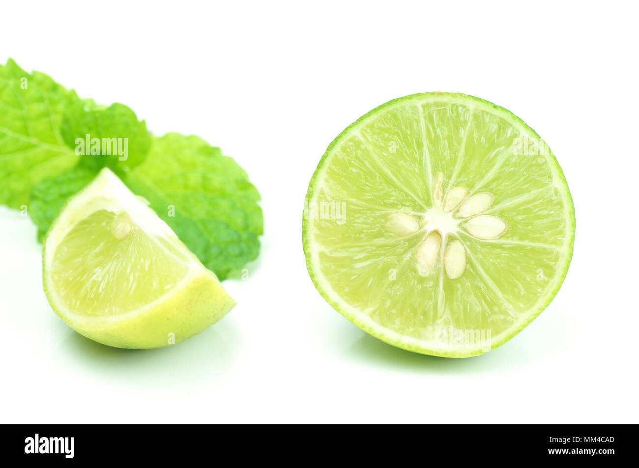 green lemon slice isolated on white background Stock Photo - Alamy