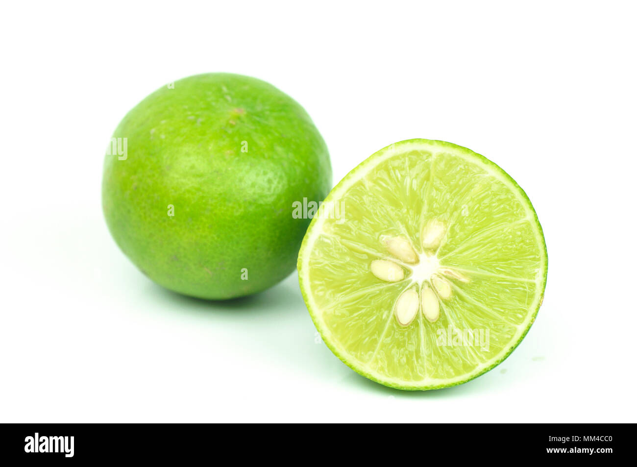 green lemon slice isolated on white background Stock Photo - Alamy