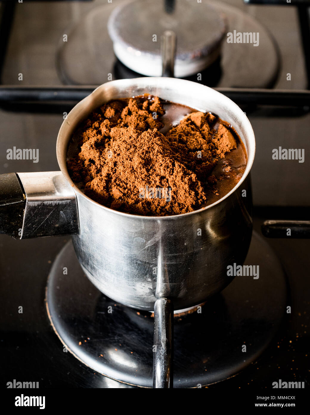 Cooking Turkish Coffee in the kitchen. traditional beverage Stock Photo ...
