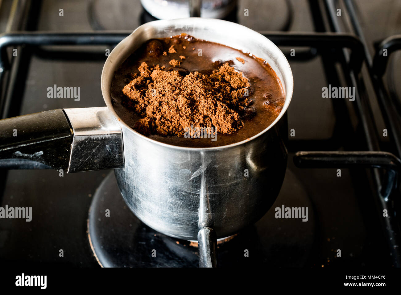 Cooking Turkish Coffee in the kitchen. traditional beverage Stock Photo ...