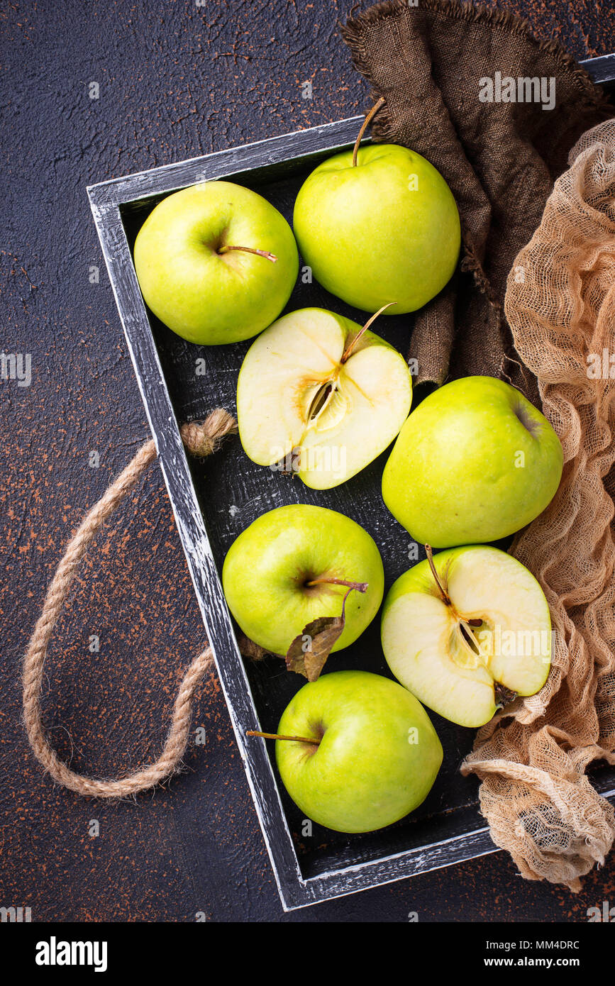 Fresh green apples on rusty background Stock Photo - Alamy