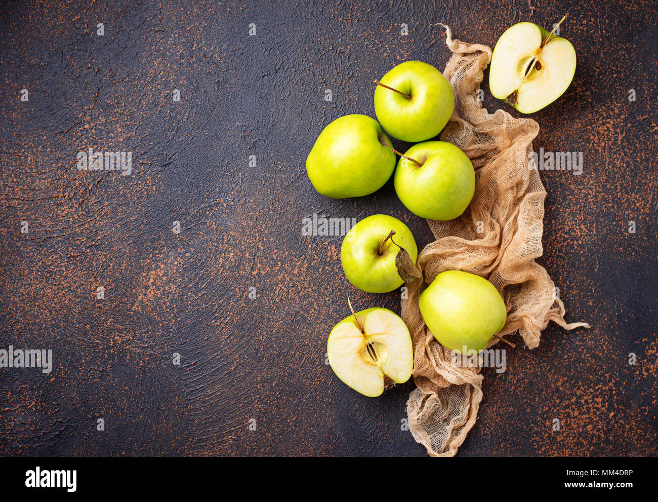 Fresh green apples on rusty background Stock Photo - Alamy