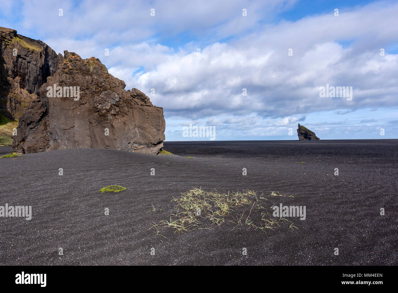 Isolated rock in black sand beach in Mýrdalssandur, Iceland Stock Photo ...