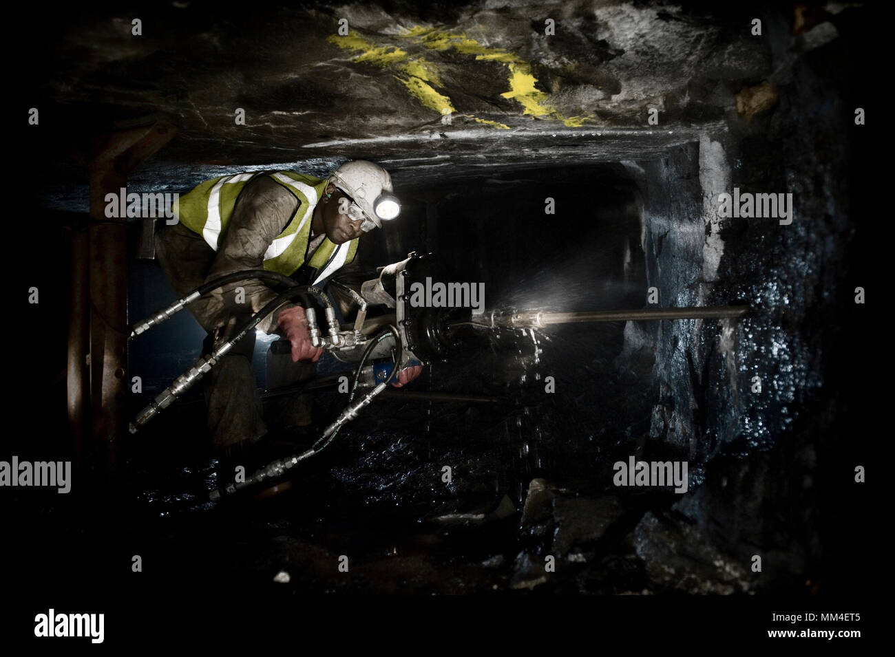 A miner drilling underground in South African gold mine Stock Photo - Alamy