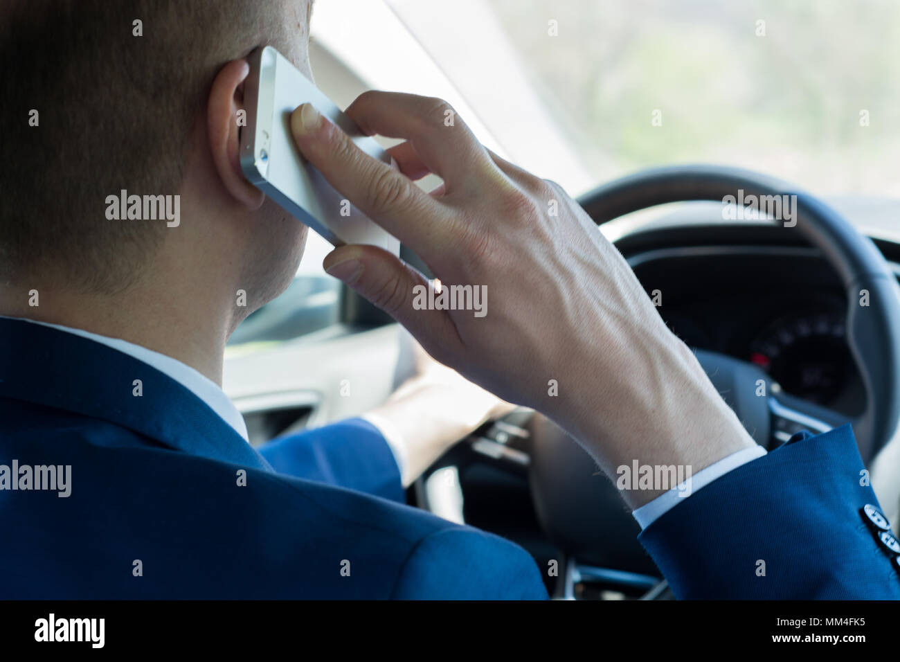 Using mobile phone in car Stock Photo - Alamy