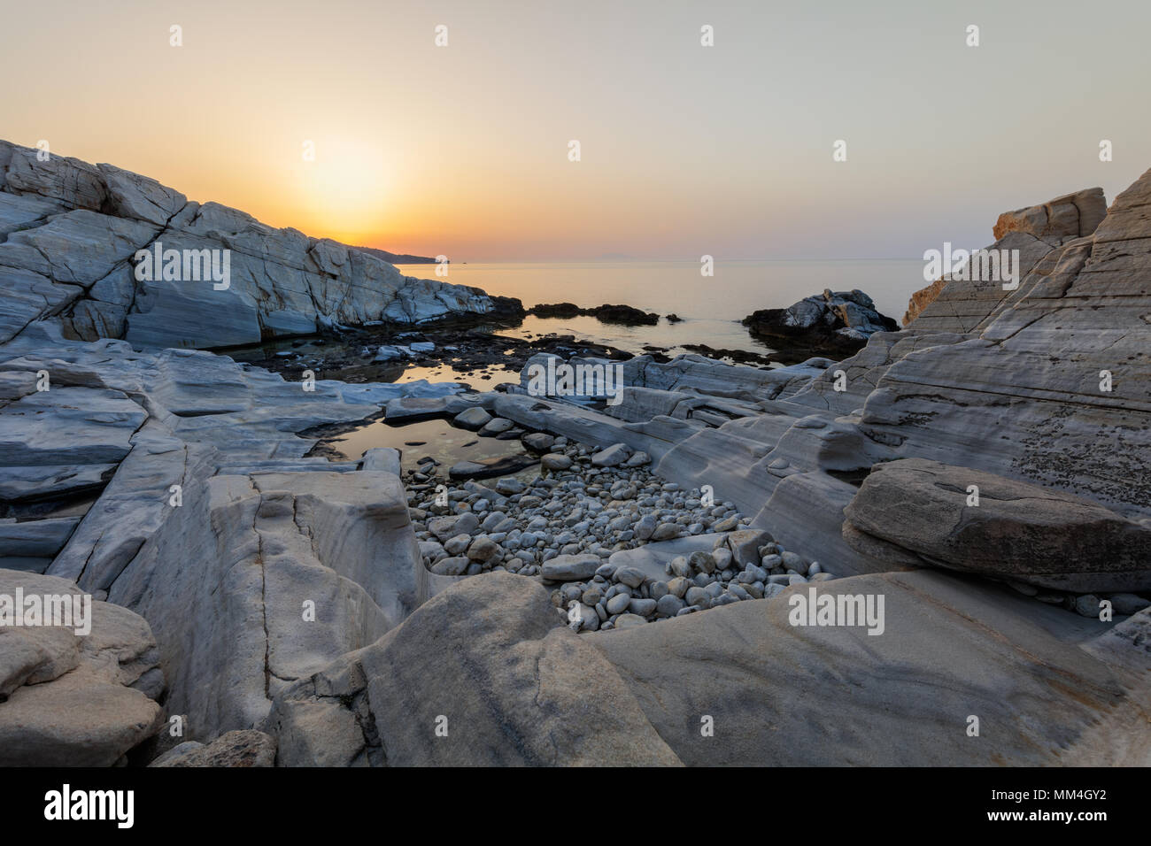 Aegean seashore and marble rocks in Aliki, Thassos island, Greece Stock ...