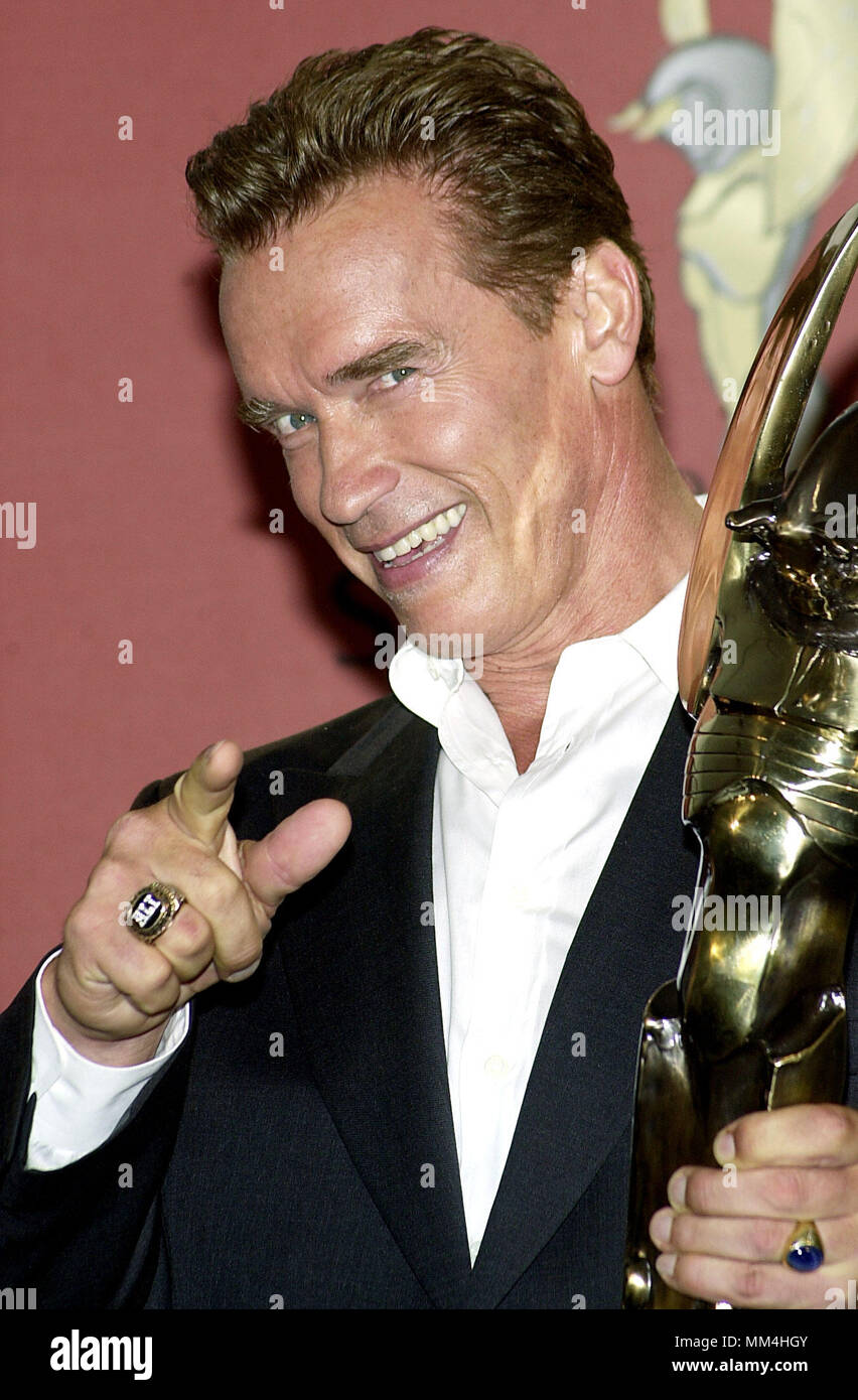 Arnold Schwarzenegger posing backstage at the 1st World Stunt Awards at ...