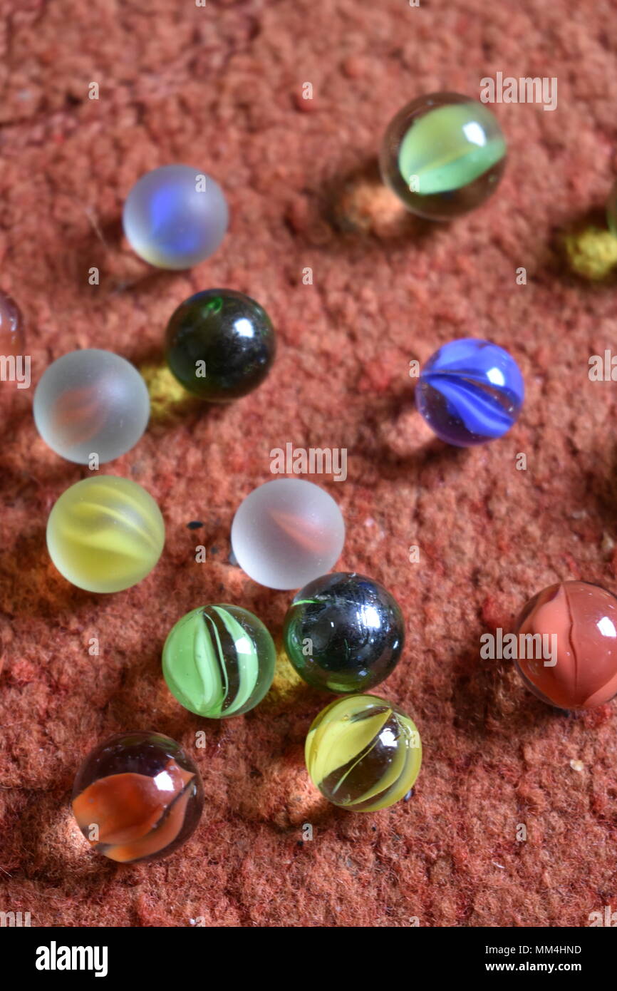 Red marbles hi-res stock photography and images - Alamy