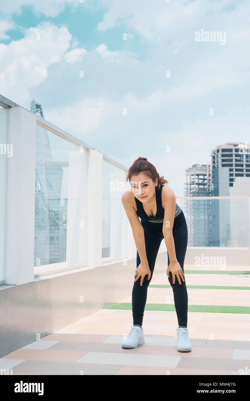 Asian female runner rest hi-res stock photography and images - Alamy