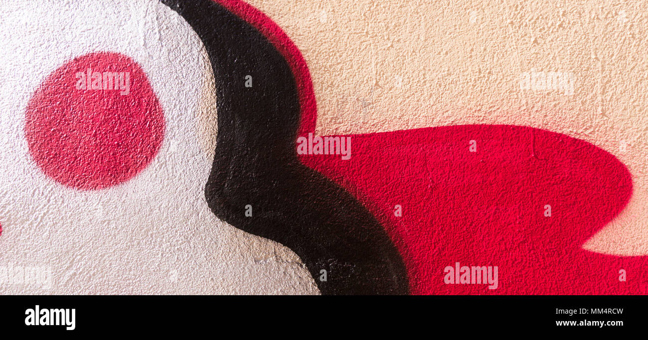 Colorful street art graffiti fragment on painted plaster wall in the ...