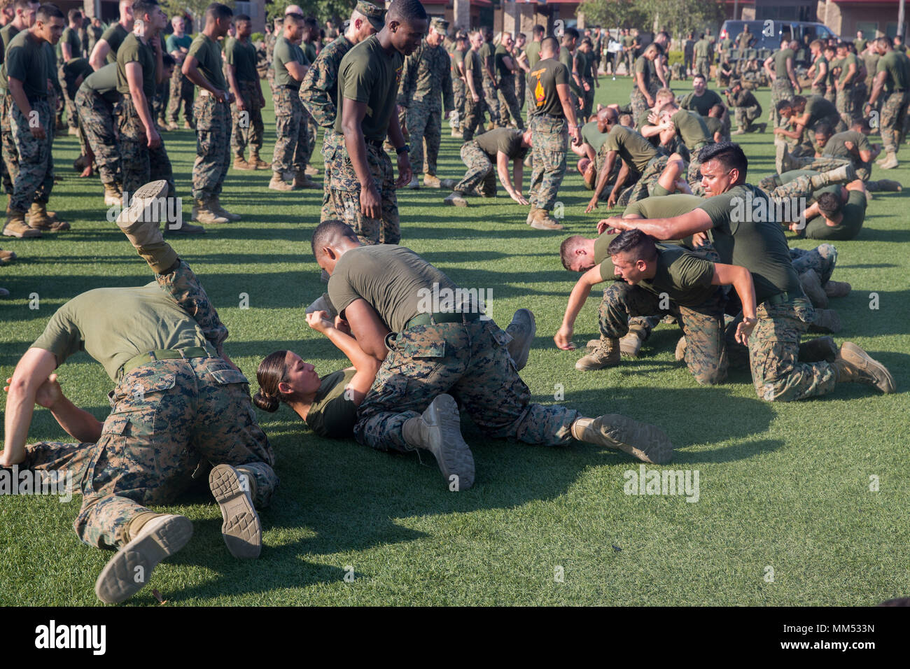 U.S. Marines with Headquarters Battalion grapple after a hike at Marine ...