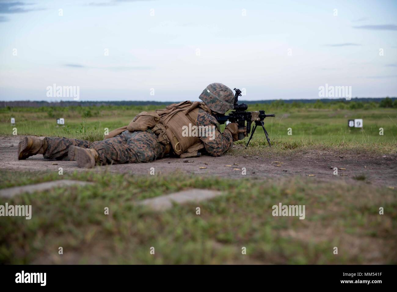 A Marine reloads his M4 carbine during a combat marksmanship program at ...