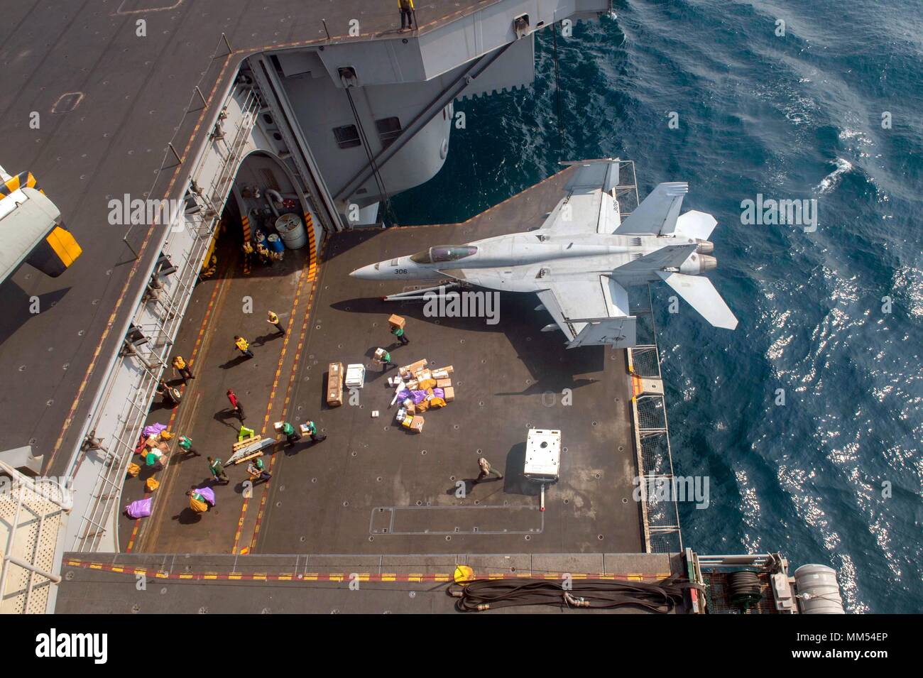 170905-N-WM647-0128 ARABIAN GULF (Sept. 5, 2017) Sailors move mail from ...