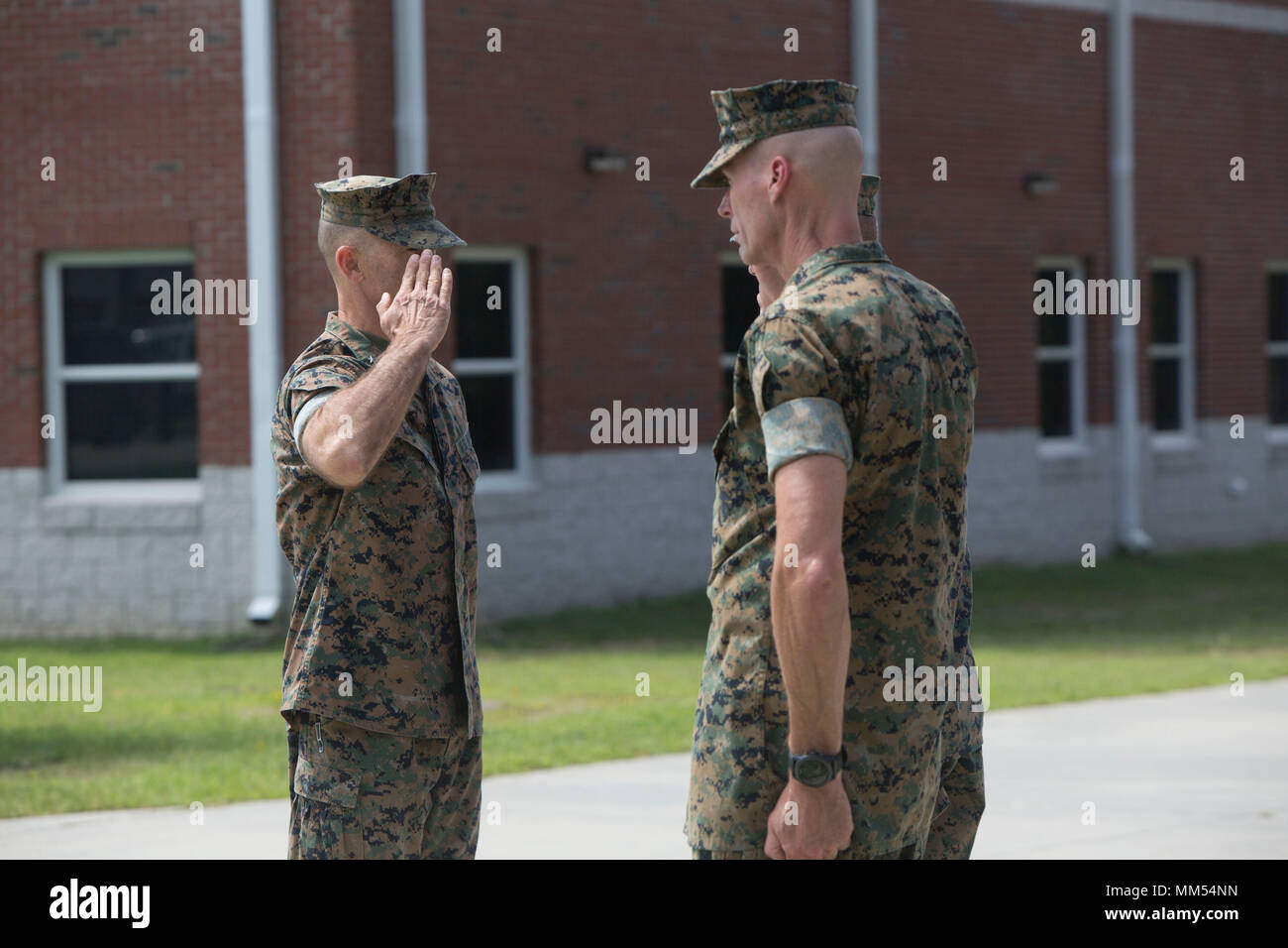 Major General John K. Love salutes LtCol. Daniel J. Gaskell before ...
