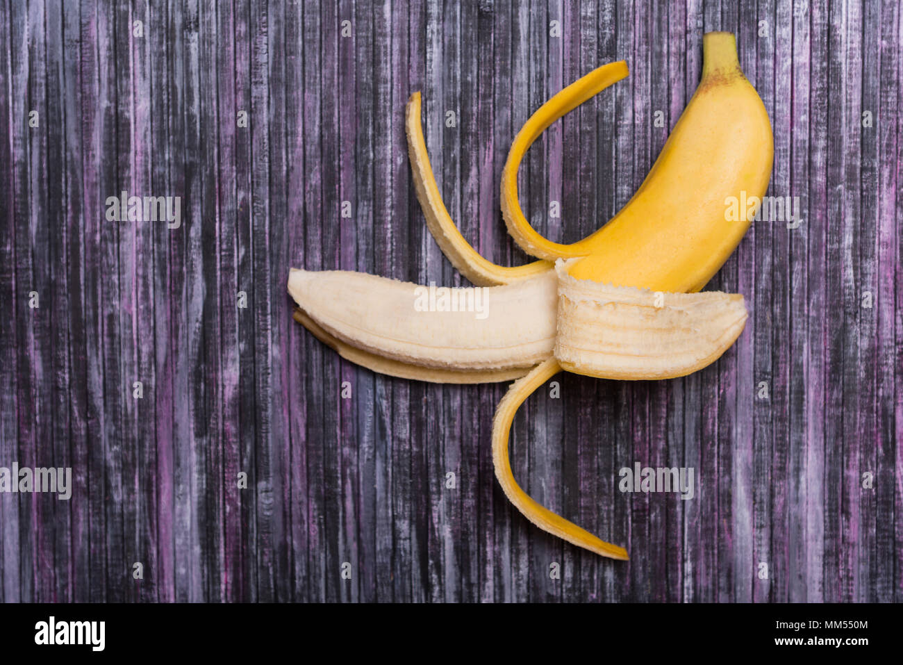 Banana on a wooden background. Useful fruit. Summer. Vacation. Fruit on ...