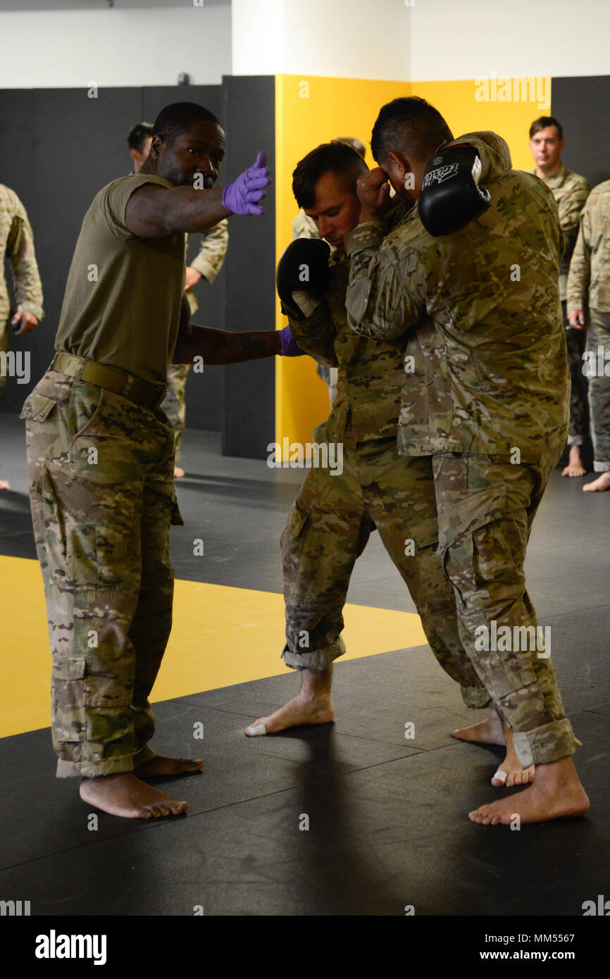 U.S. Army Staff Sgt. Robert Ward (left), a master combative instructor ...