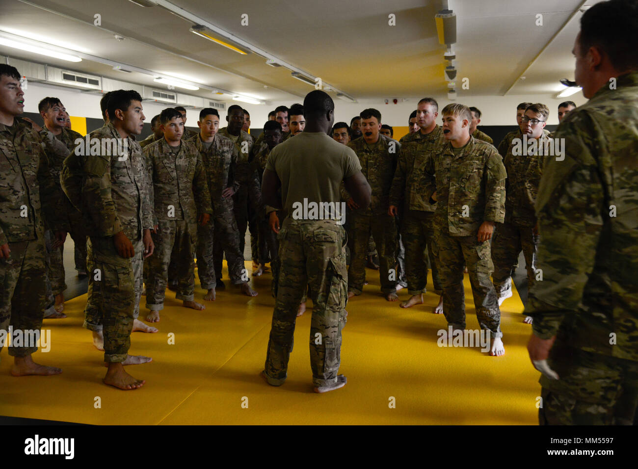 U.S. Army Staff Sgt. Robert Ward (middle), a Master Combatives ...